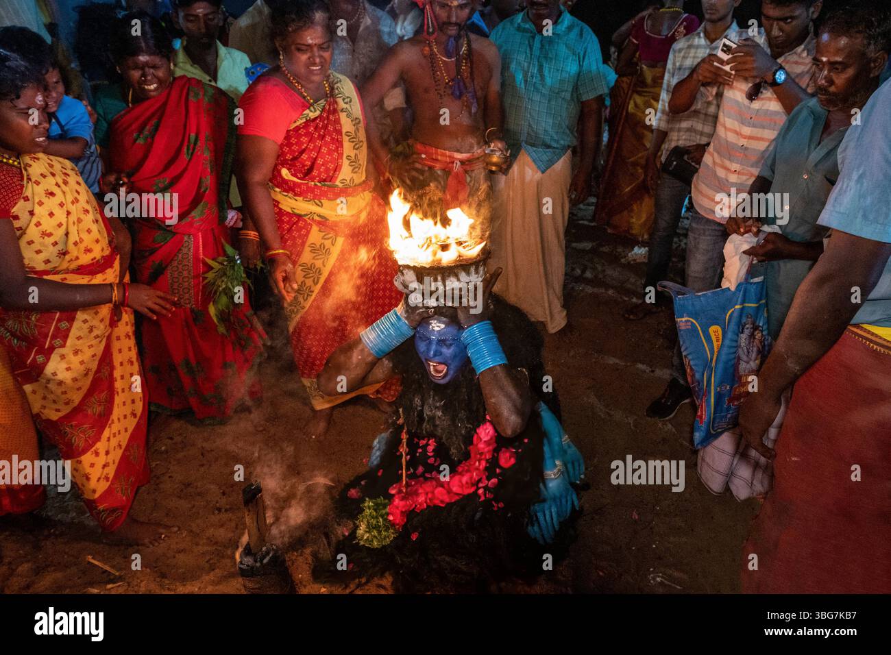 The parade ends in the beach of Kulasai village. The devotees are ...