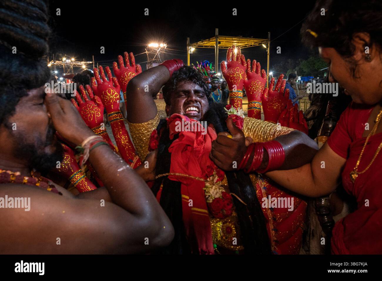 The parade ends in the beach of Kulasai village. The devotees are ...