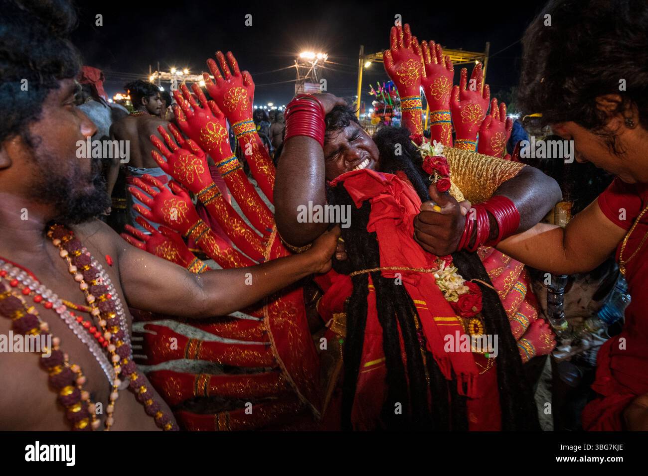 The parade ends in the beach of Kulasai village. The devotees are ...
