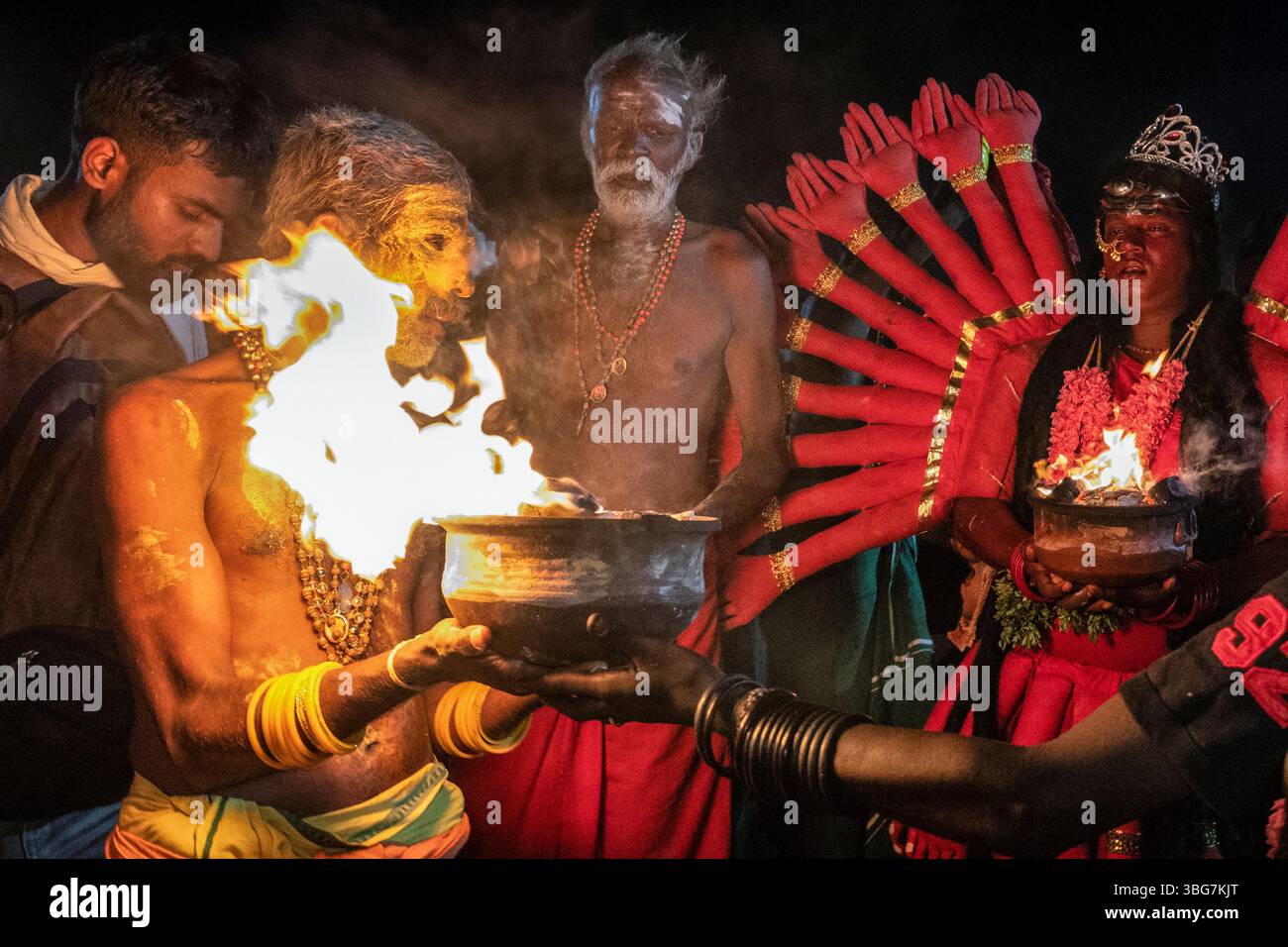 The parade ends in the beach of Kulasai village. The devotees are ...