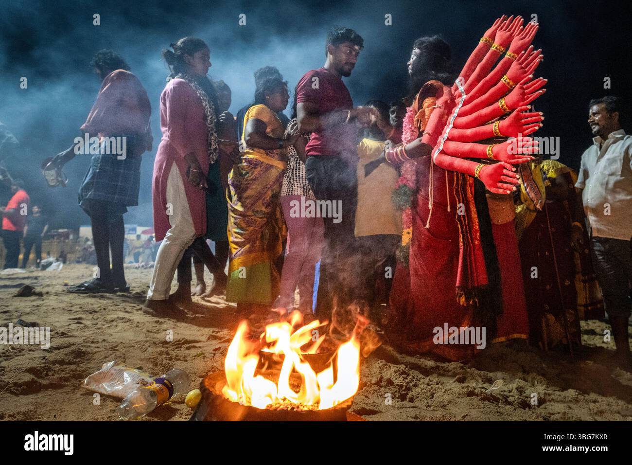 The parade ends in the beach of Kulasai village. The devotees are ...