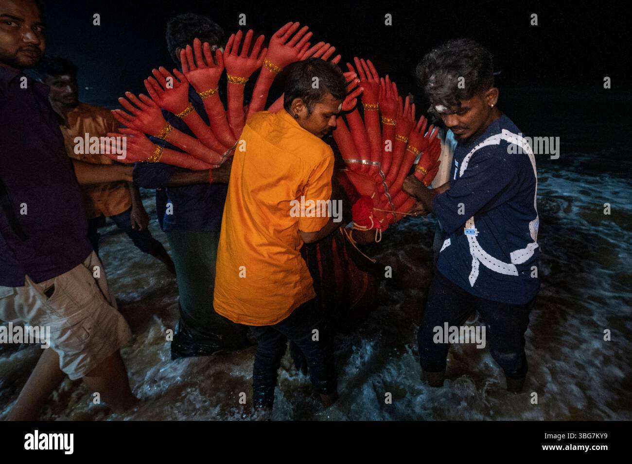The parade ends in the beach of Kulasai village. The devotees are ...