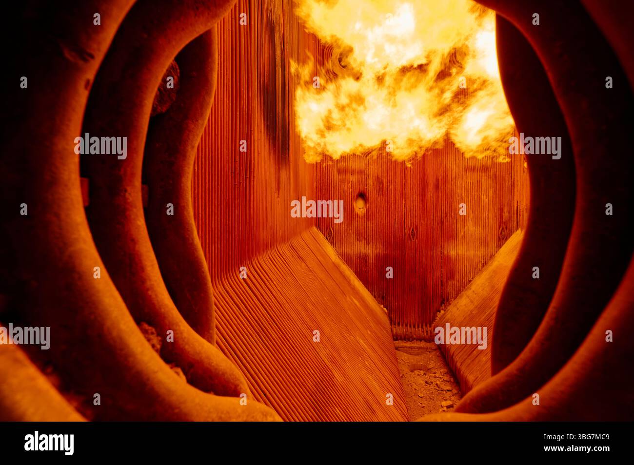 Interior view of a steam boiler furnace showing intense flame ...
