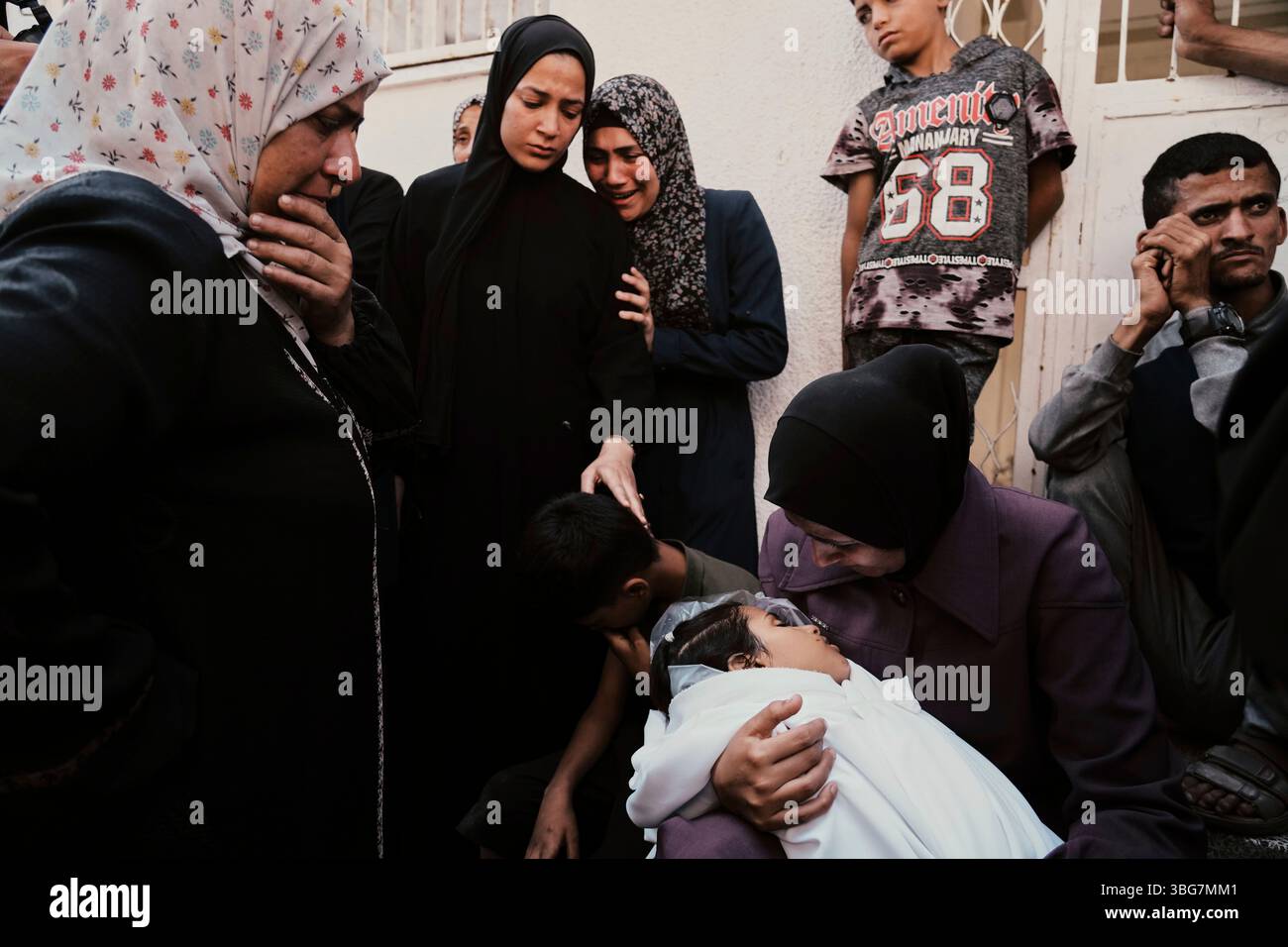 Palestinians mourn around the body Mayar Abu Odeh, 8, who was killed in ...