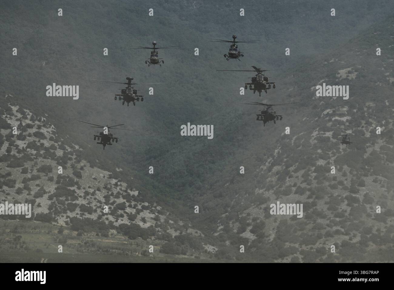 Apache helicopters fly in formation as soldiers take part in the U.S ...