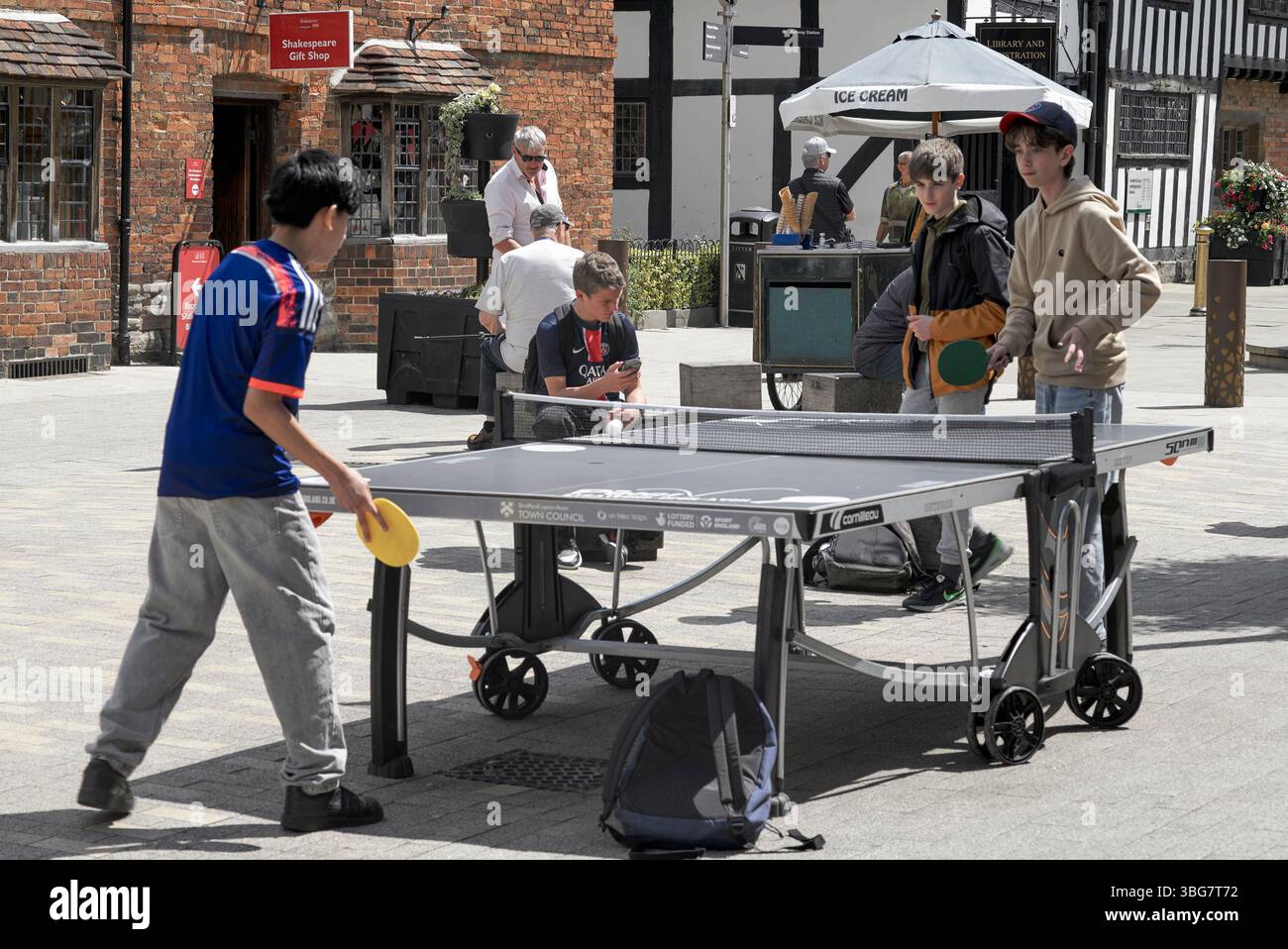 Children playing table tennis. Henley Street, Stratford upon Avon ...