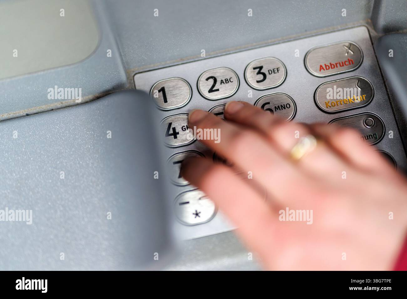 Munich, Germany. 29th May, 2025. A woman operates an open ATM on the ...