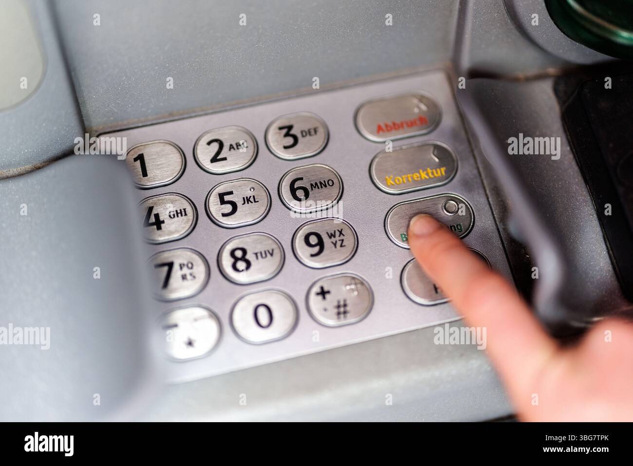Munich, Germany. 29th May, 2025. A woman operates an open ATM on the ...