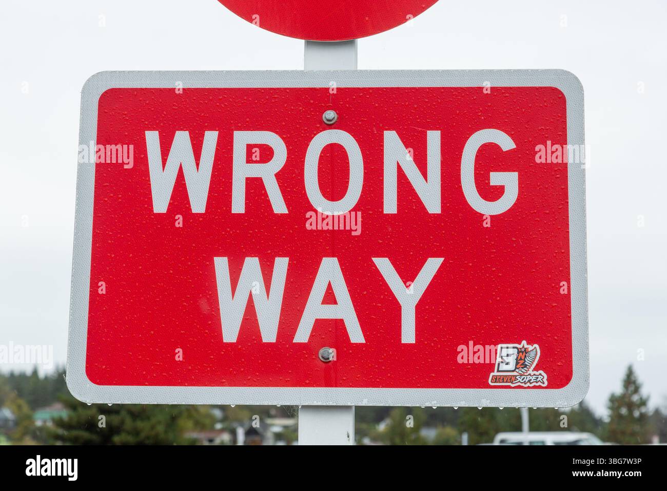 A red a white Wrong Way sign in New Zealand Stock Photo - Alamy