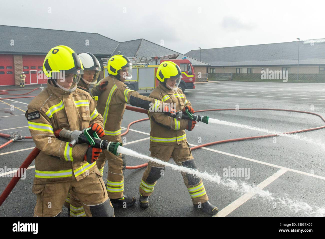Scottish Fire and Rescue Service trainee firefighters during training ...