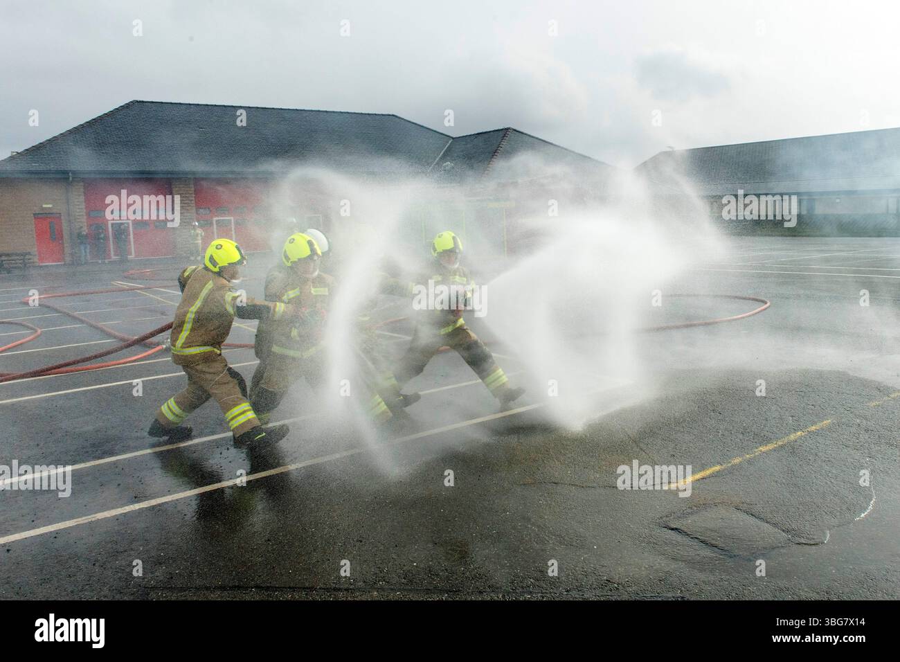 Scottish Fire and Rescue Service trainee firefighters during training ...
