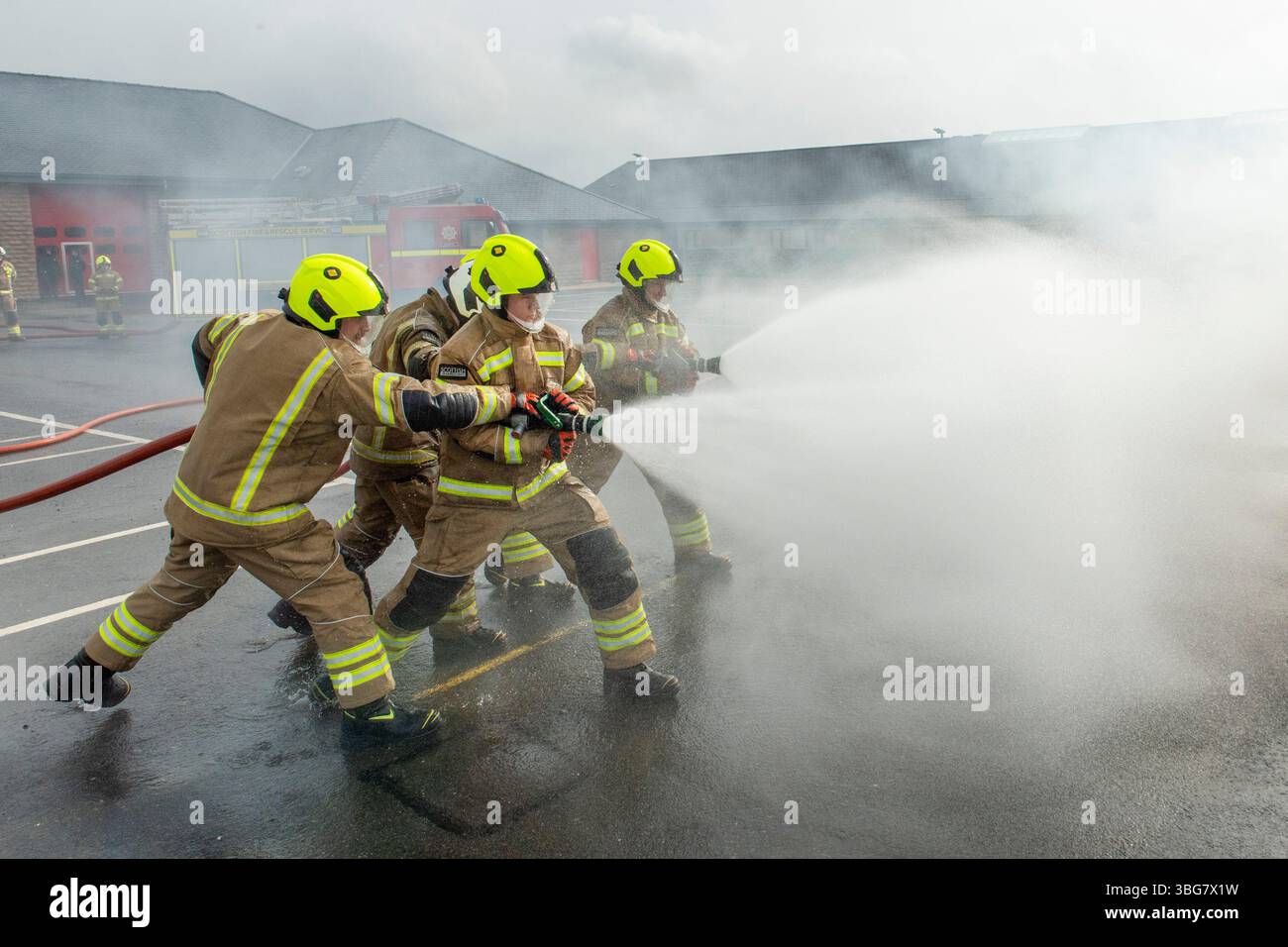 Scottish Fire and Rescue Service trainee firefighters during training ...