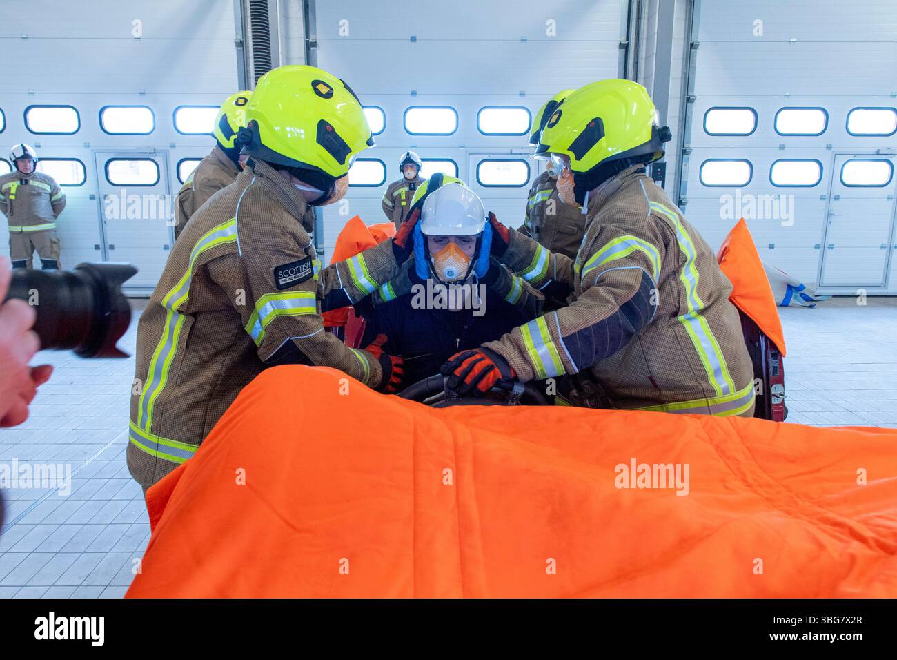 Scottish Fire and Rescue Service trainee firefighters during training ...