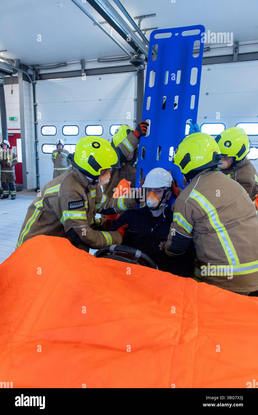 Scottish Fire and Rescue Service trainee firefighters during training ...