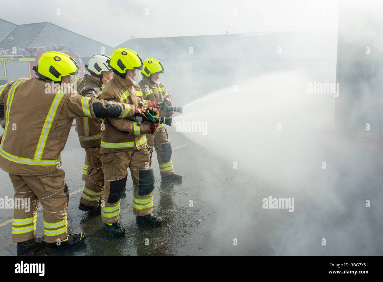 Scottish Fire and Rescue Service trainee firefighters during training ...