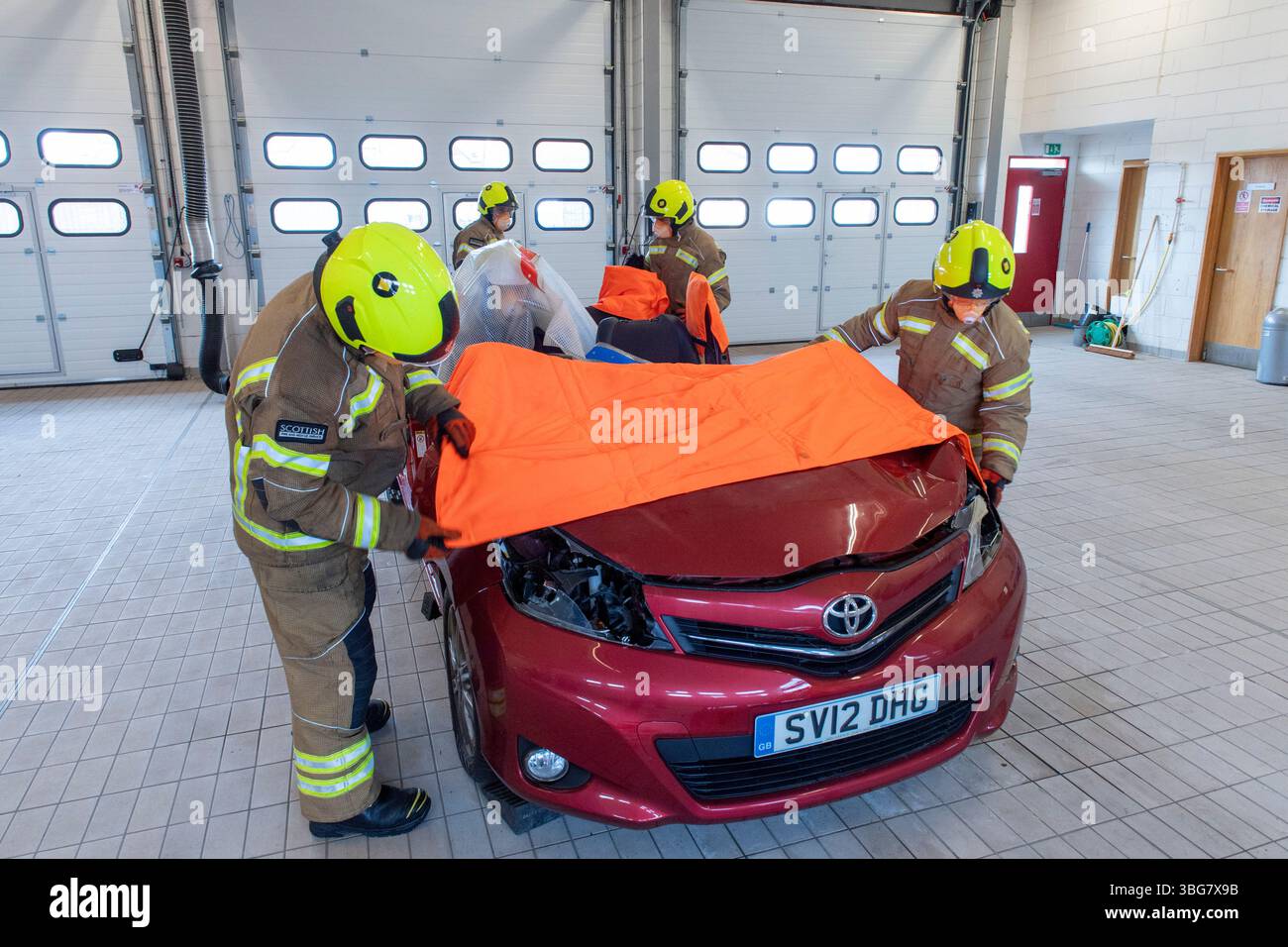 Scottish Fire and Rescue Service trainee firefighters during training ...