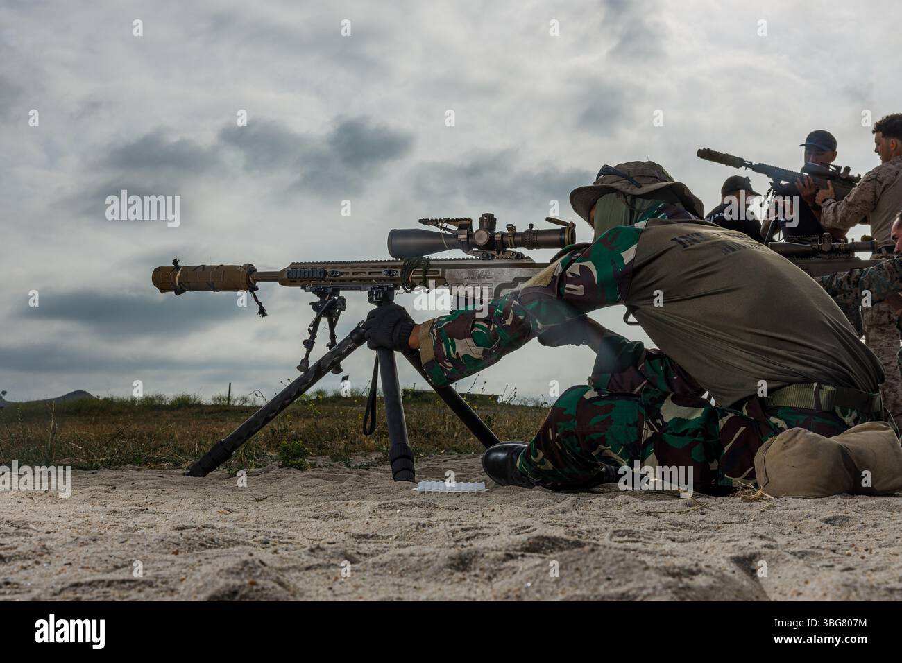 A member of the Indonesian Korps Marinir fires a Mk22 Mod 0 advanced ...