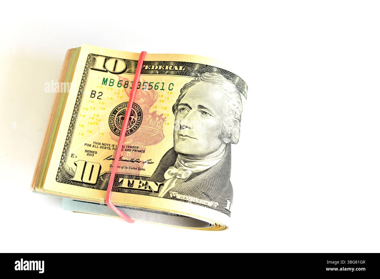 A stack of 10 dollar bills, folded in half and tied with a rubber band ...