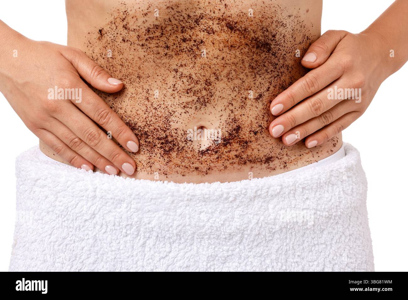 Woman applying body scrub onto her belly against white background ...