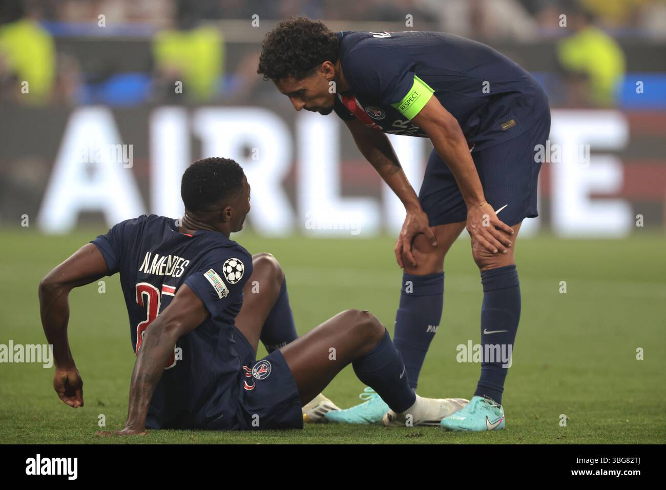 Munich, Germany. 31st May, 2025. Marquinhos of PSG checks on team mate Nuno Mendes as he pulls ...