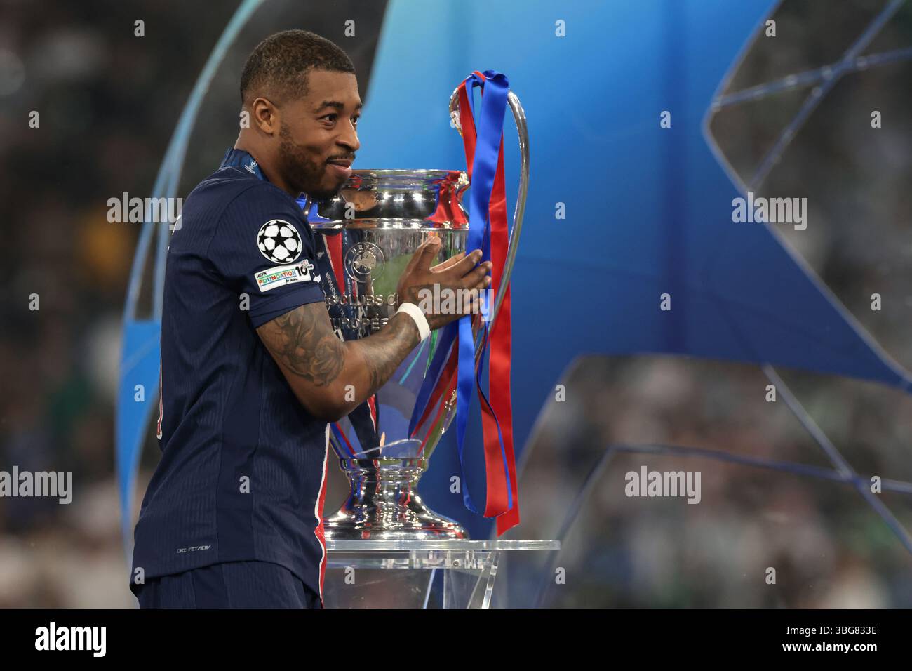 Munich, Germany. 31st May, 2025. Presnel Kimpembe of PSG reacts with ...