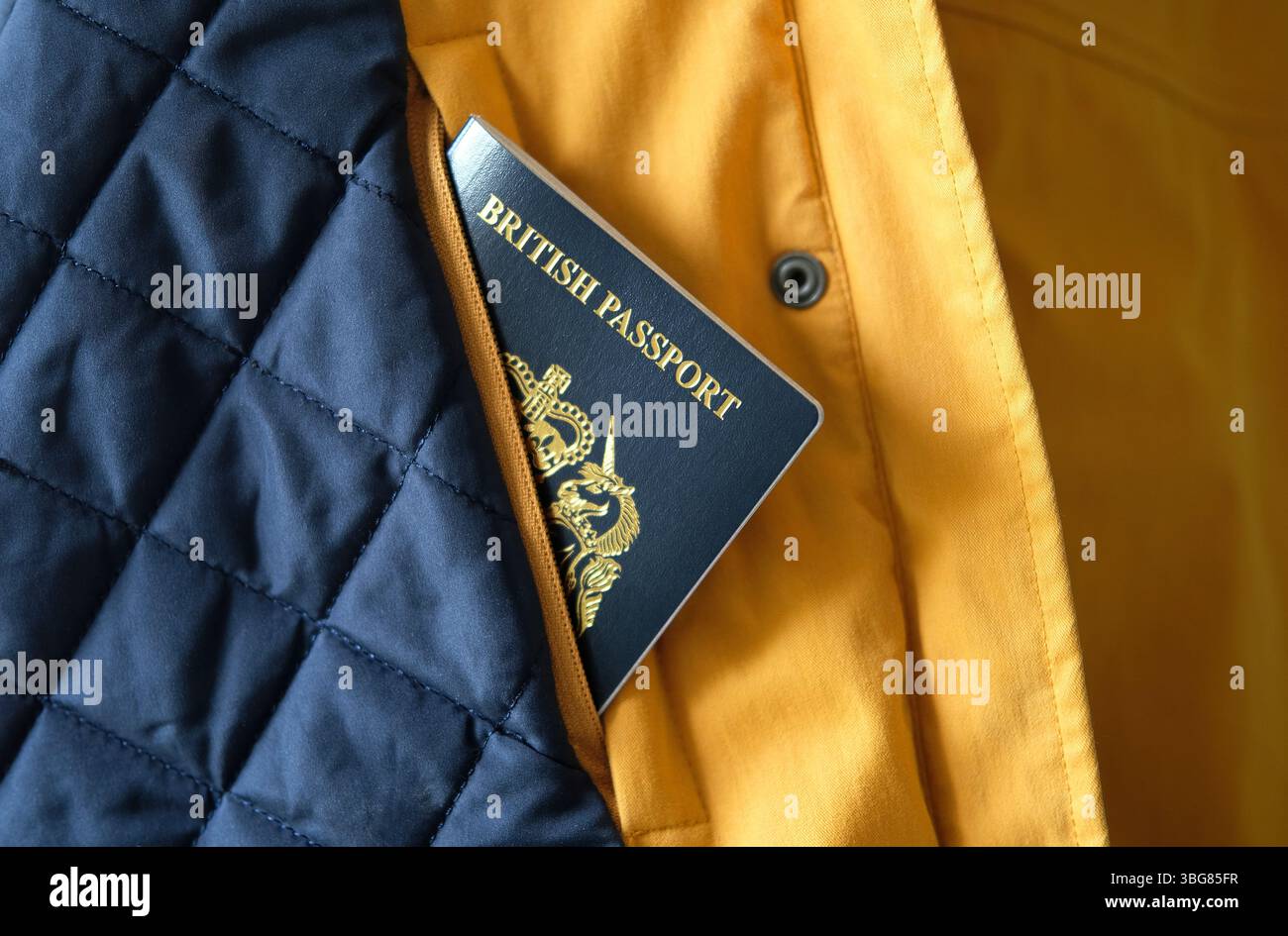 british passport in yellow waterproof coat pocket Stock Photo - Alamy