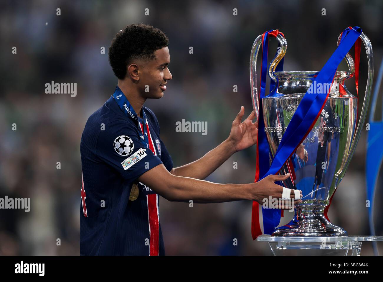 Senny Mayulu of Paris Saint-Germain FC celebrates with the trophy ...