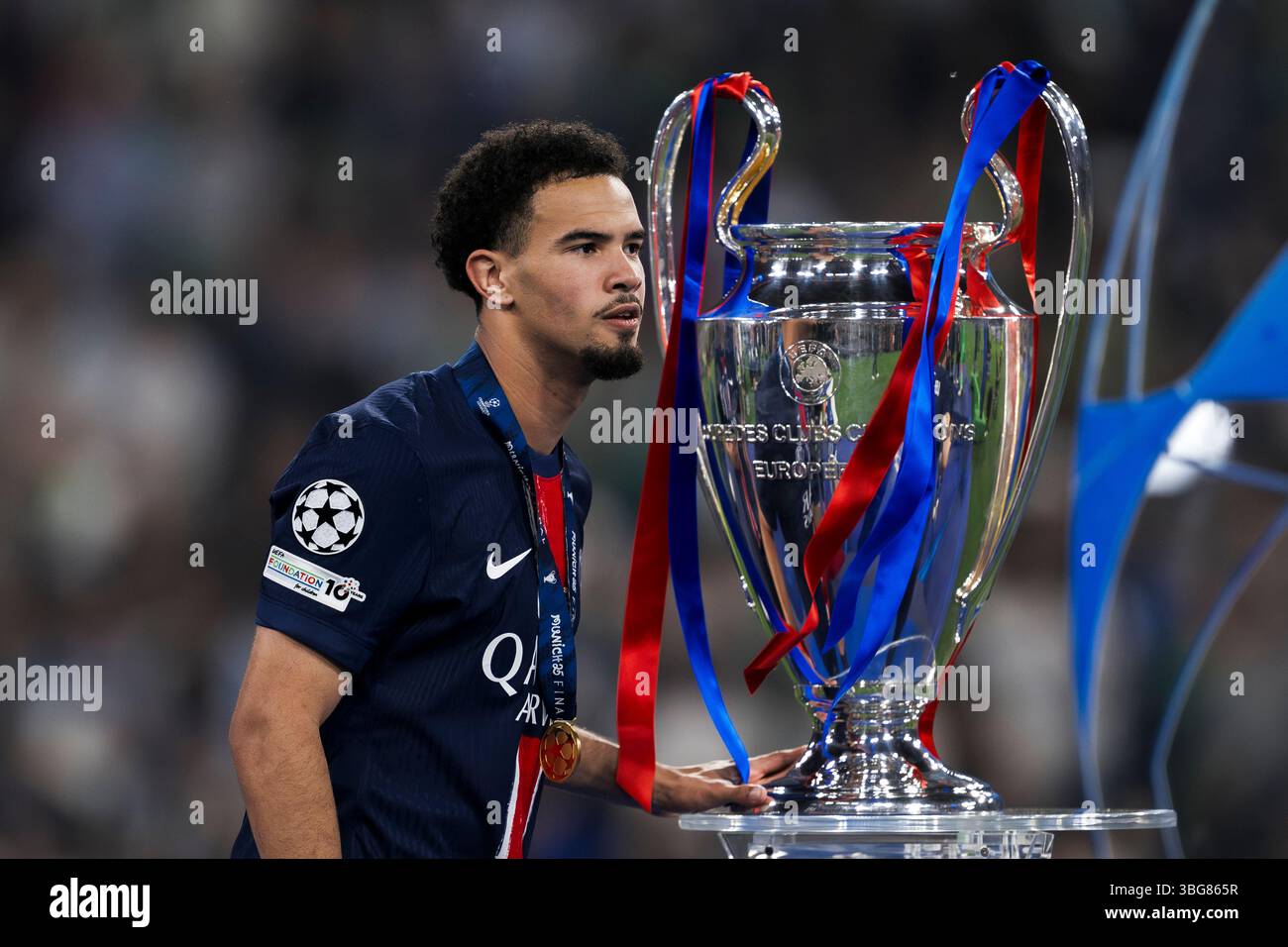Warren Zaire-Emery of Paris Saint-Germain FC celebrates with the trophy ...