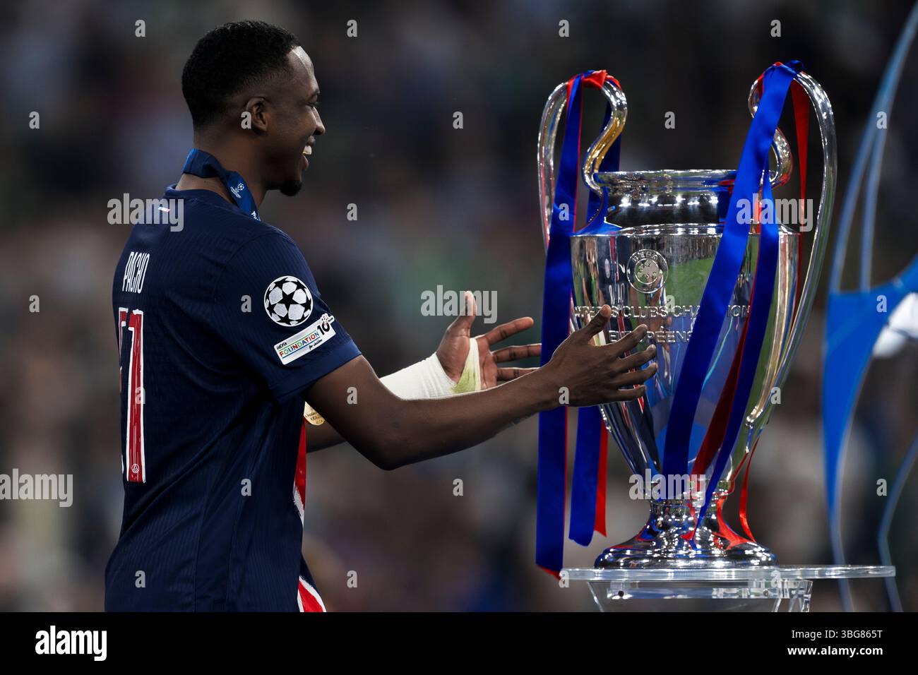Willian Pacho of Paris Saint-Germain FC celebrates with the trophy ...