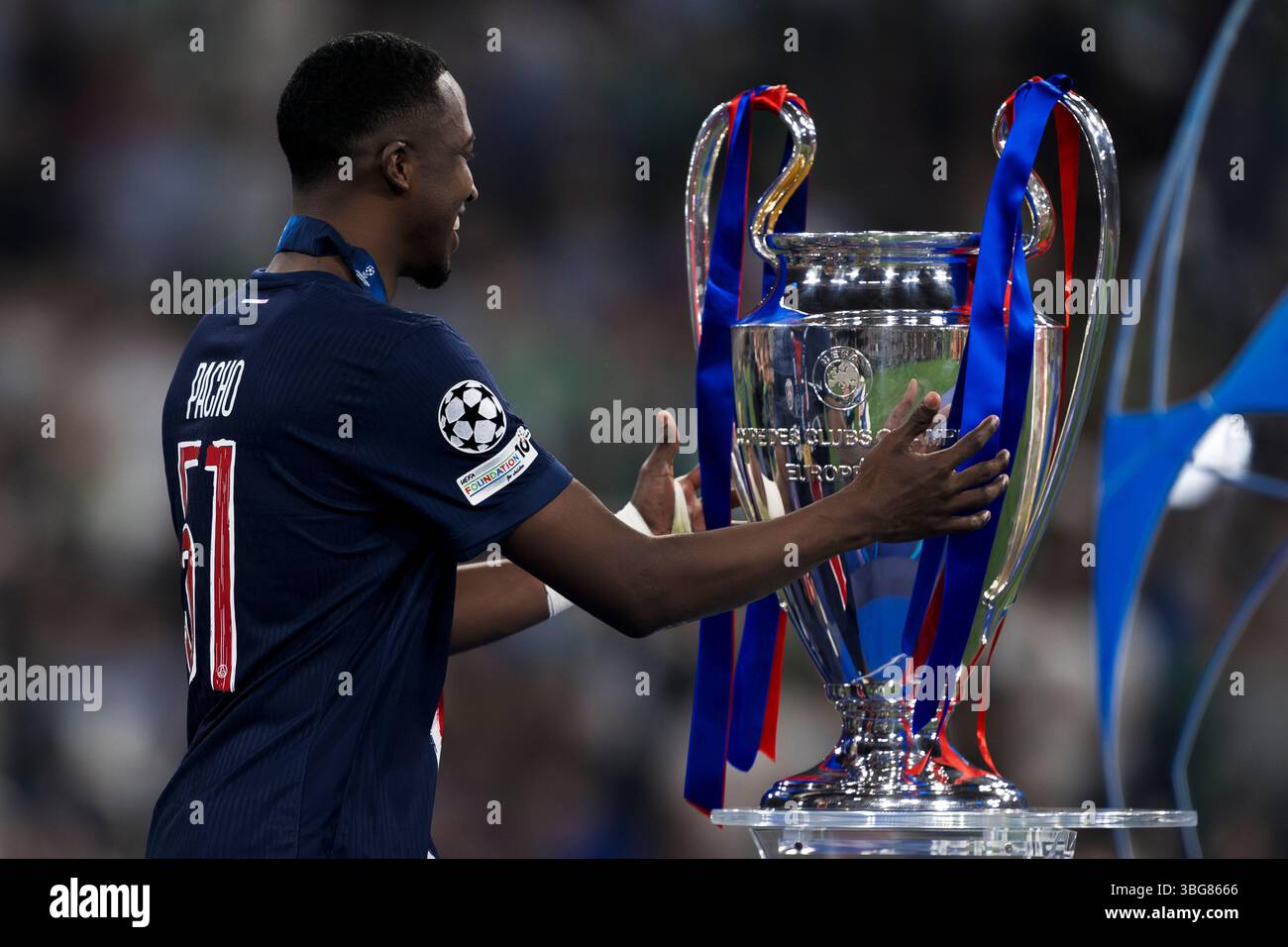 Willian Pacho of Paris Saint-Germain FC celebrates with the trophy ...