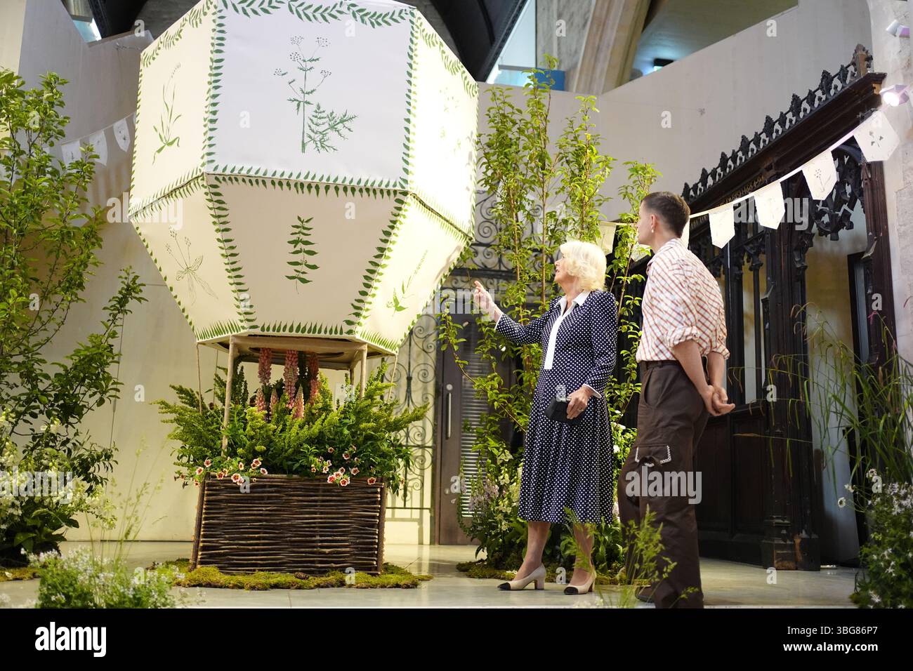 Queen Camilla looking at 'Flowers will take you where you need to go ...
