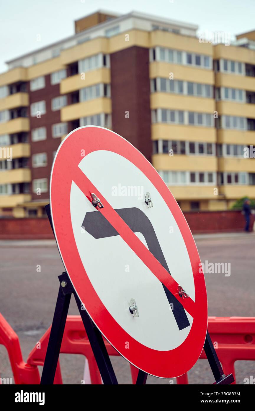No left turn sign at road junction infront of apartment block,UK Stock ...