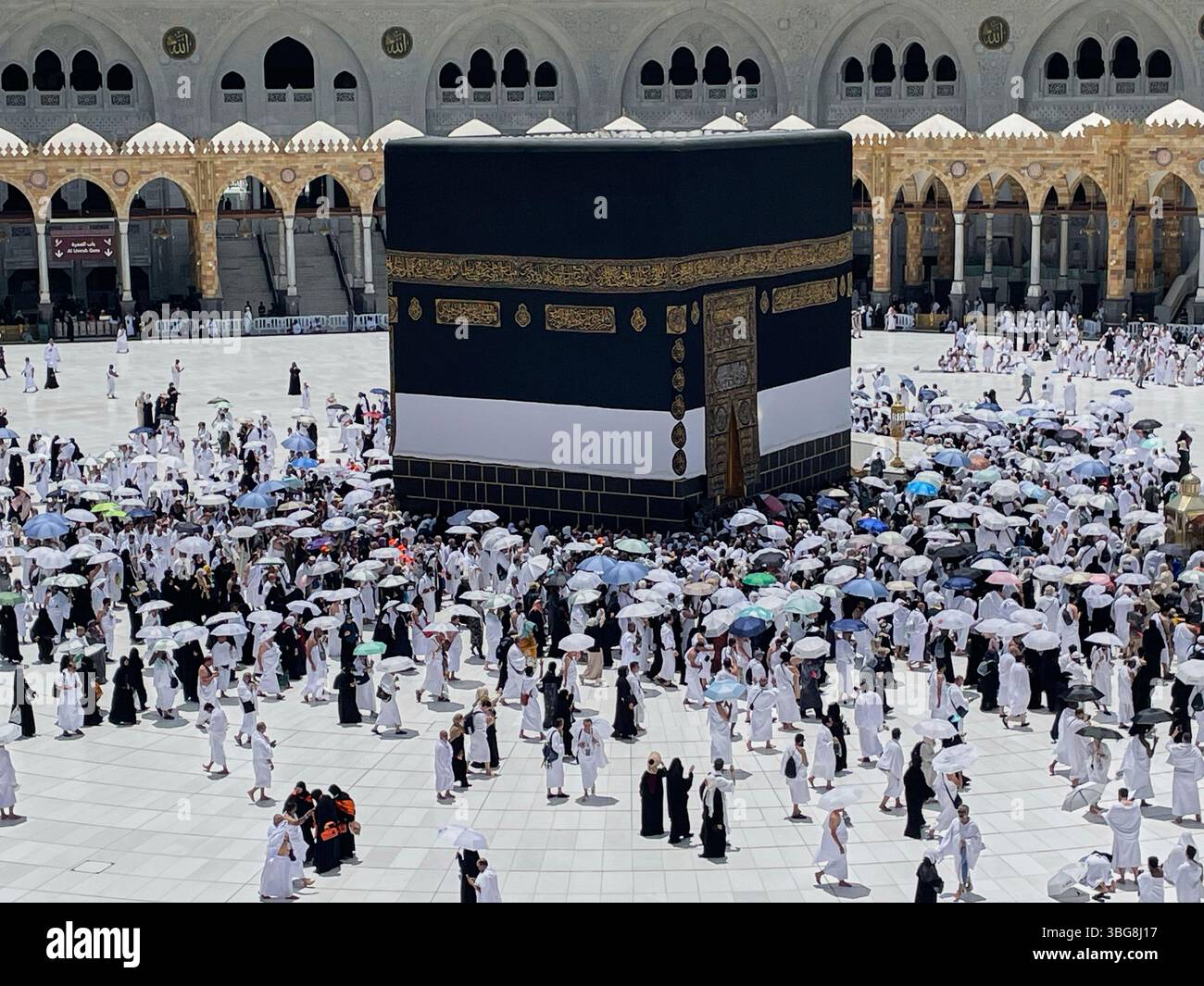 Muslim pilgrims walk around the Kaaba, the cubic building at the Grand ...
