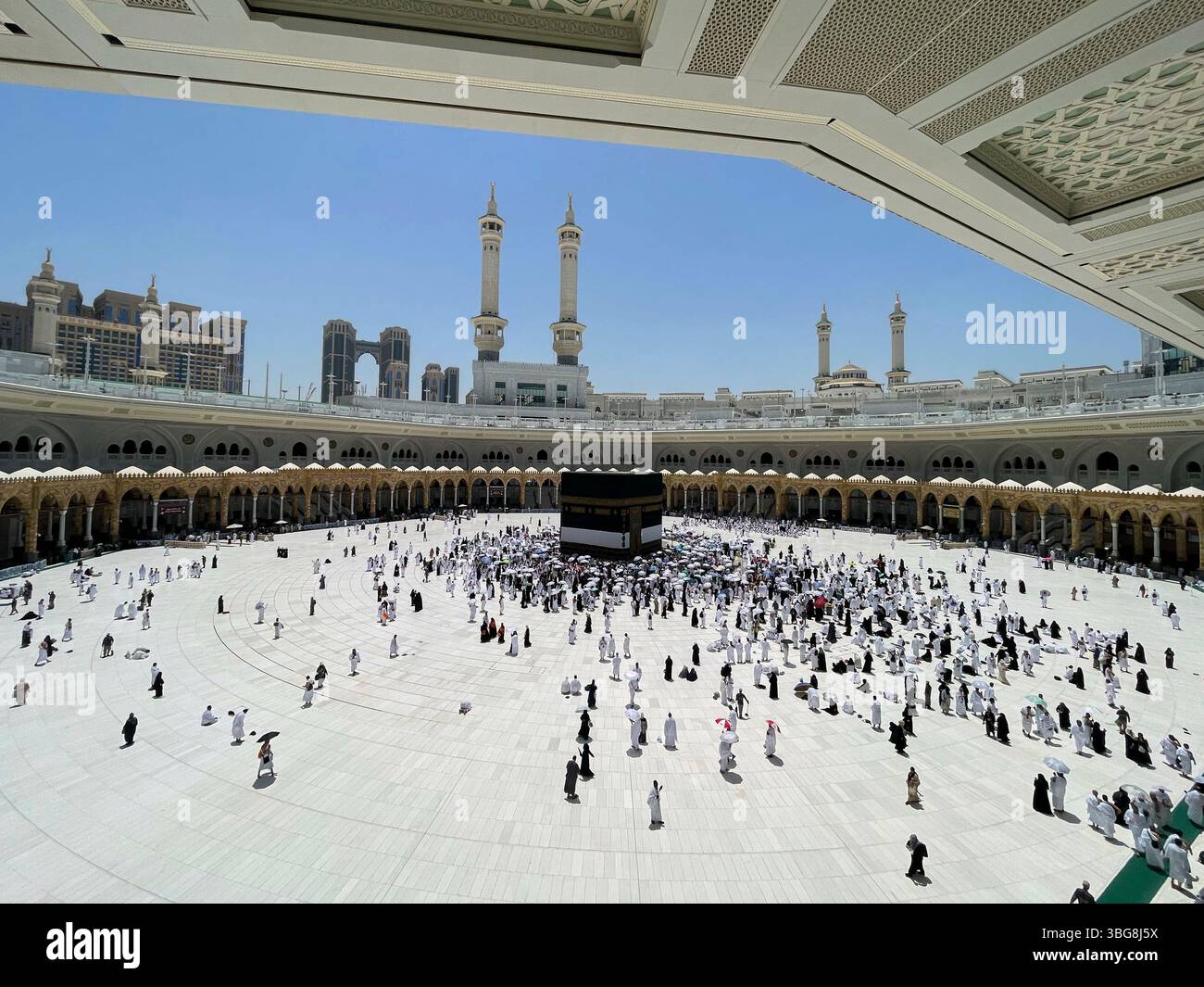 Muslim pilgrims walk around the Kaaba, the cubic building at the Grand ...
