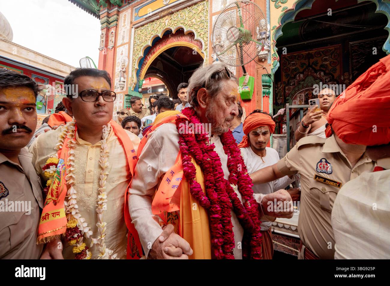 Elon Musk's father Errol Musk, center, coming out of Hanuman Garhi ...
