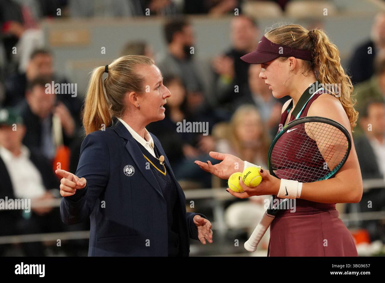 Russia's Mirra Andreeva, right, speaks with umpire Miriam Bley during ...