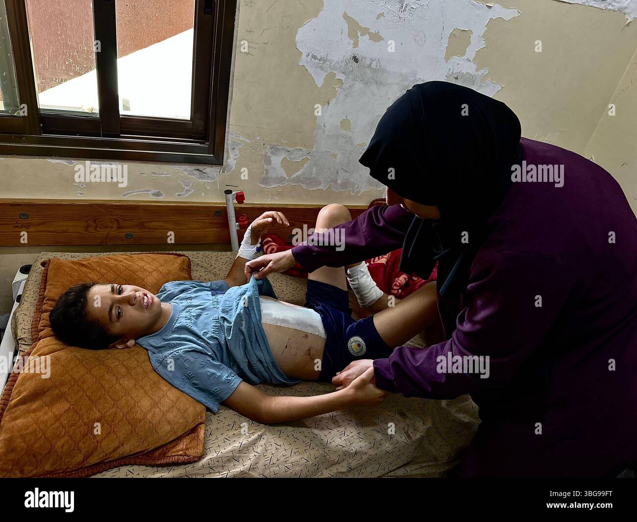 Palestinian children are receiving medical care at Nasser Medical Complex due to injuries ...