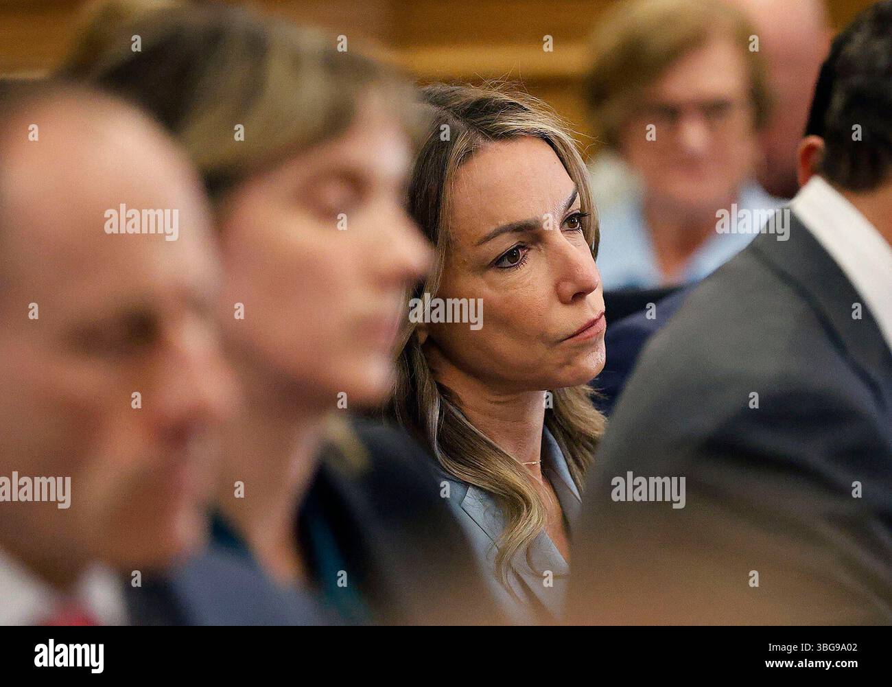 Karen Read listens to witness Brian Loughran on the stand at Norfolk ...