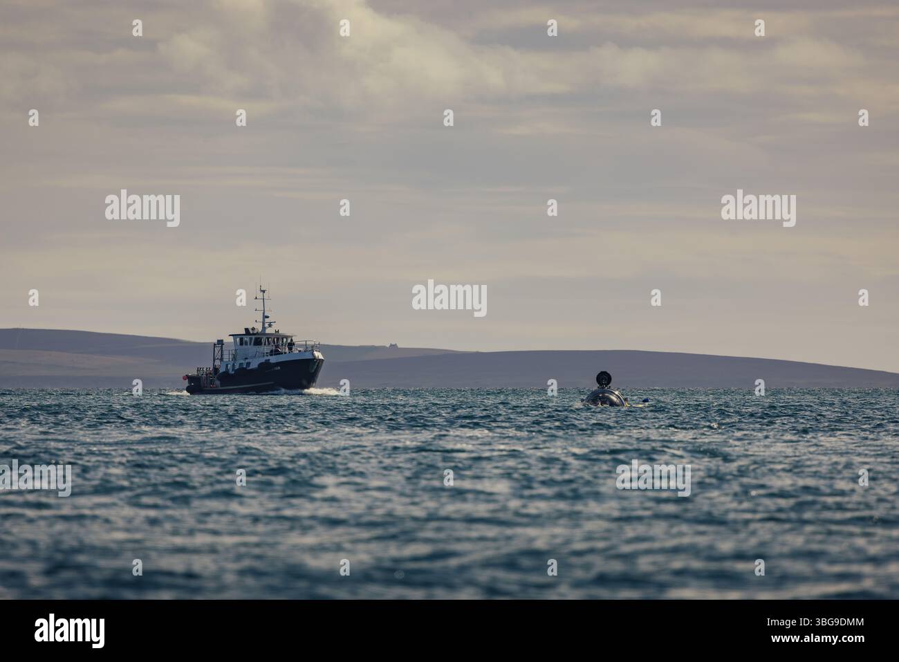 A research vessel and a submersible operate in open water near the site ...