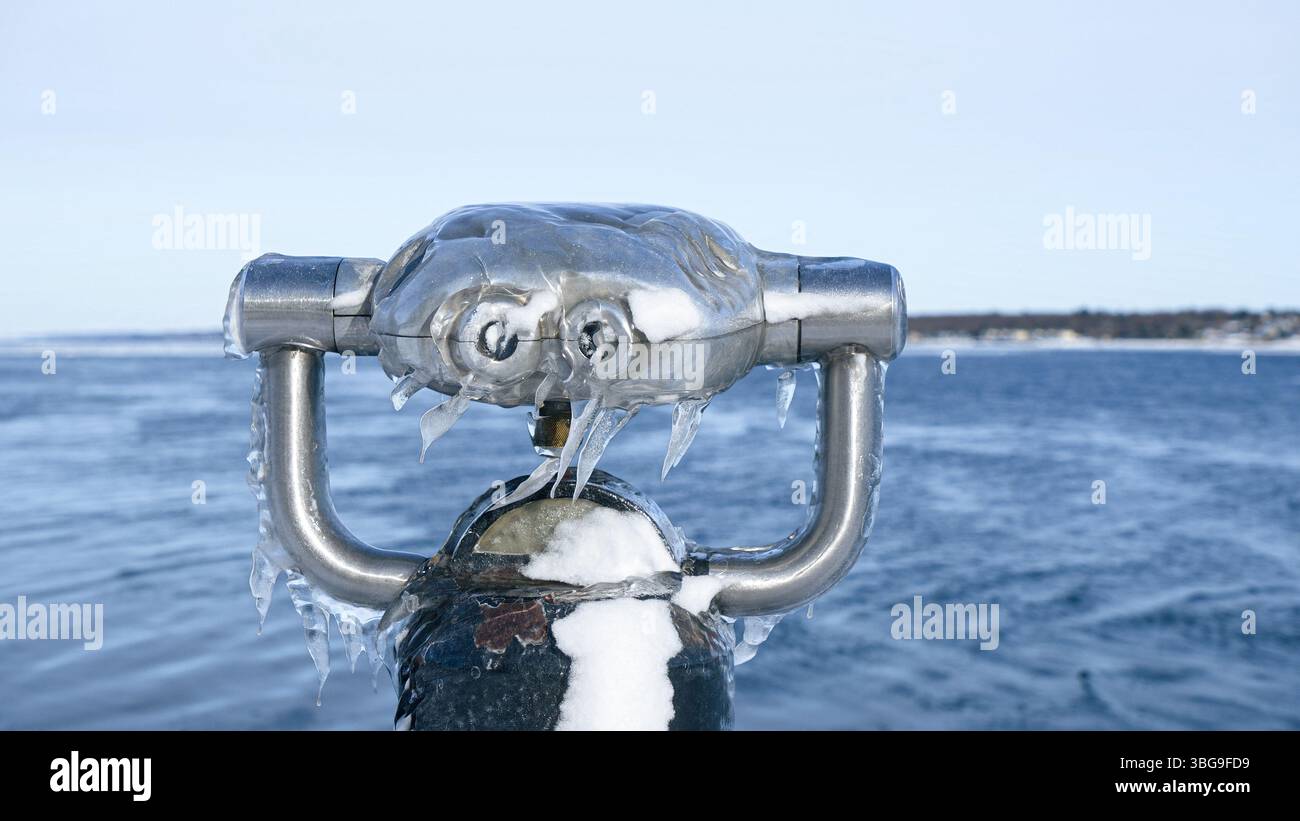 Frozen View Through a Public Telescope Sights Overlooking Icy Lake ...