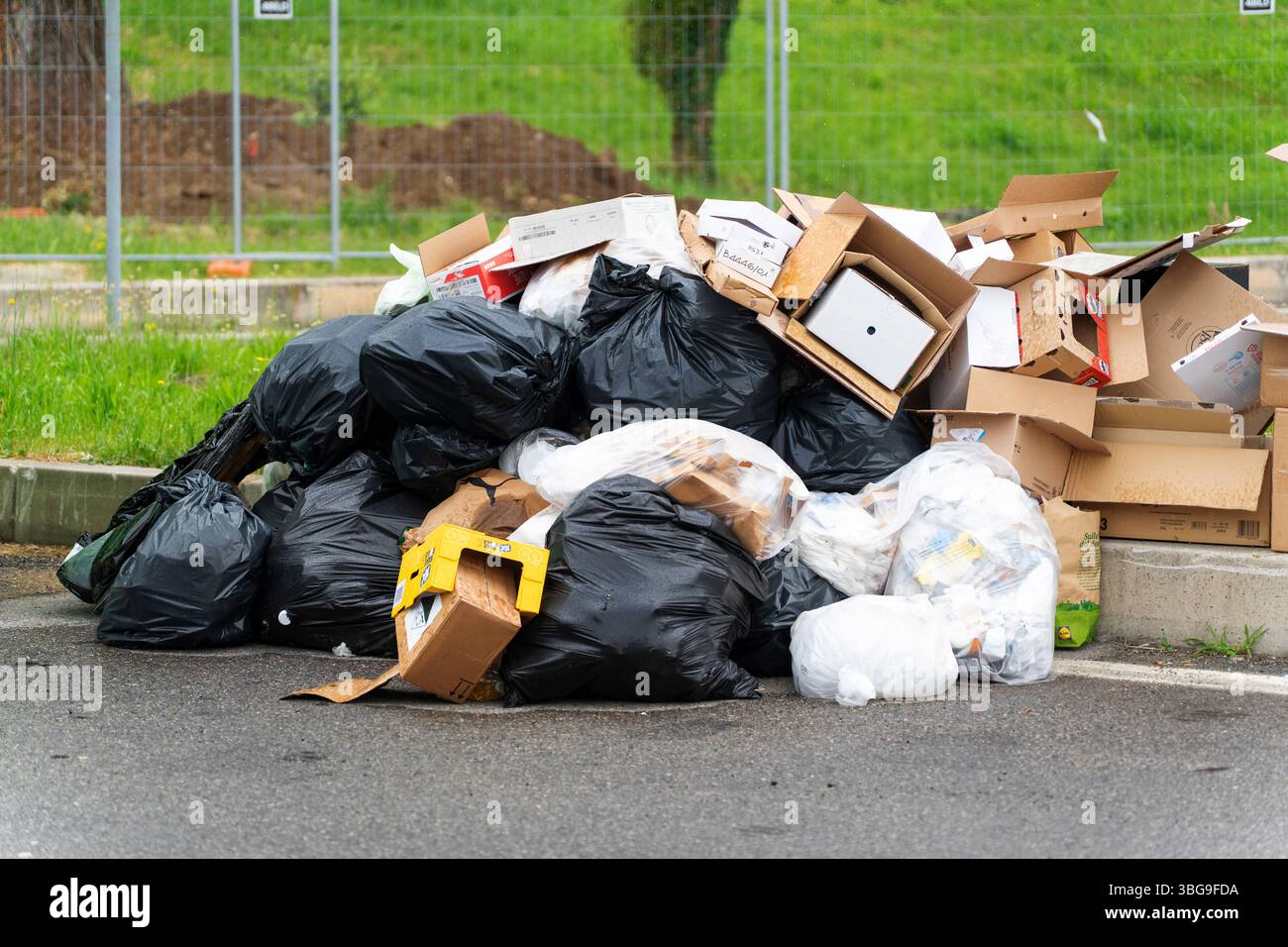 Italy - 4 June 2025: A large amount of garbage lies disorderly by the ...