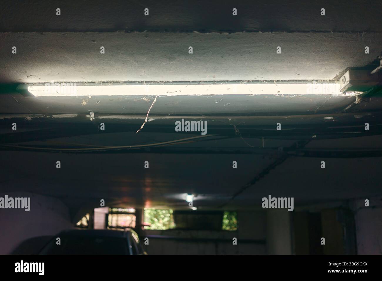 Cobweb lighting in the basement on the ceiling Stock Photo - Alamy