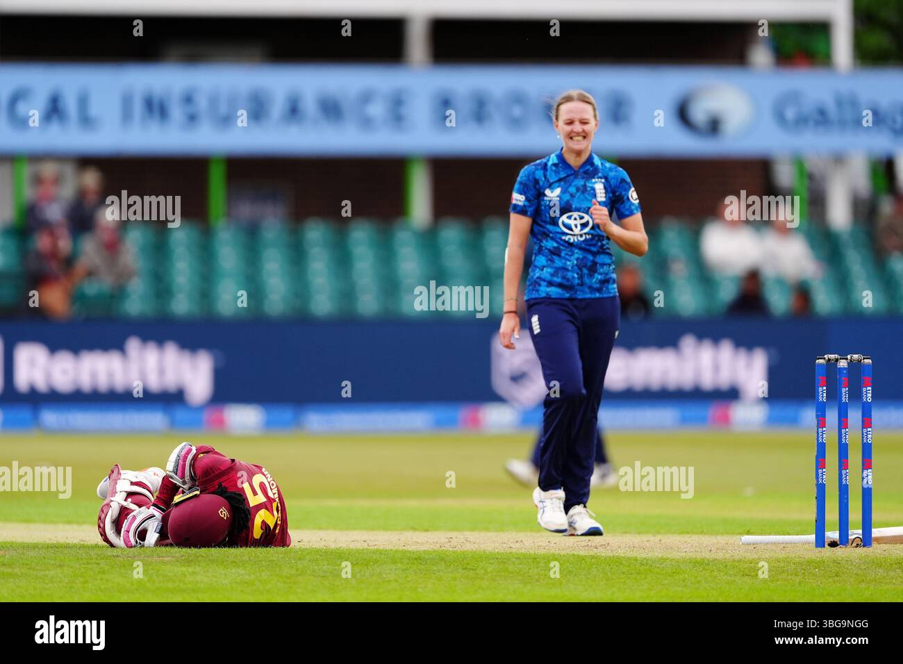West Indies' Realeanna Grimmond (left) goes down injured after being ...