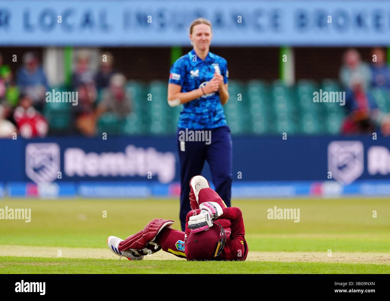 West Indies' Realeanna Grimmond (front) goes down injured after being ...