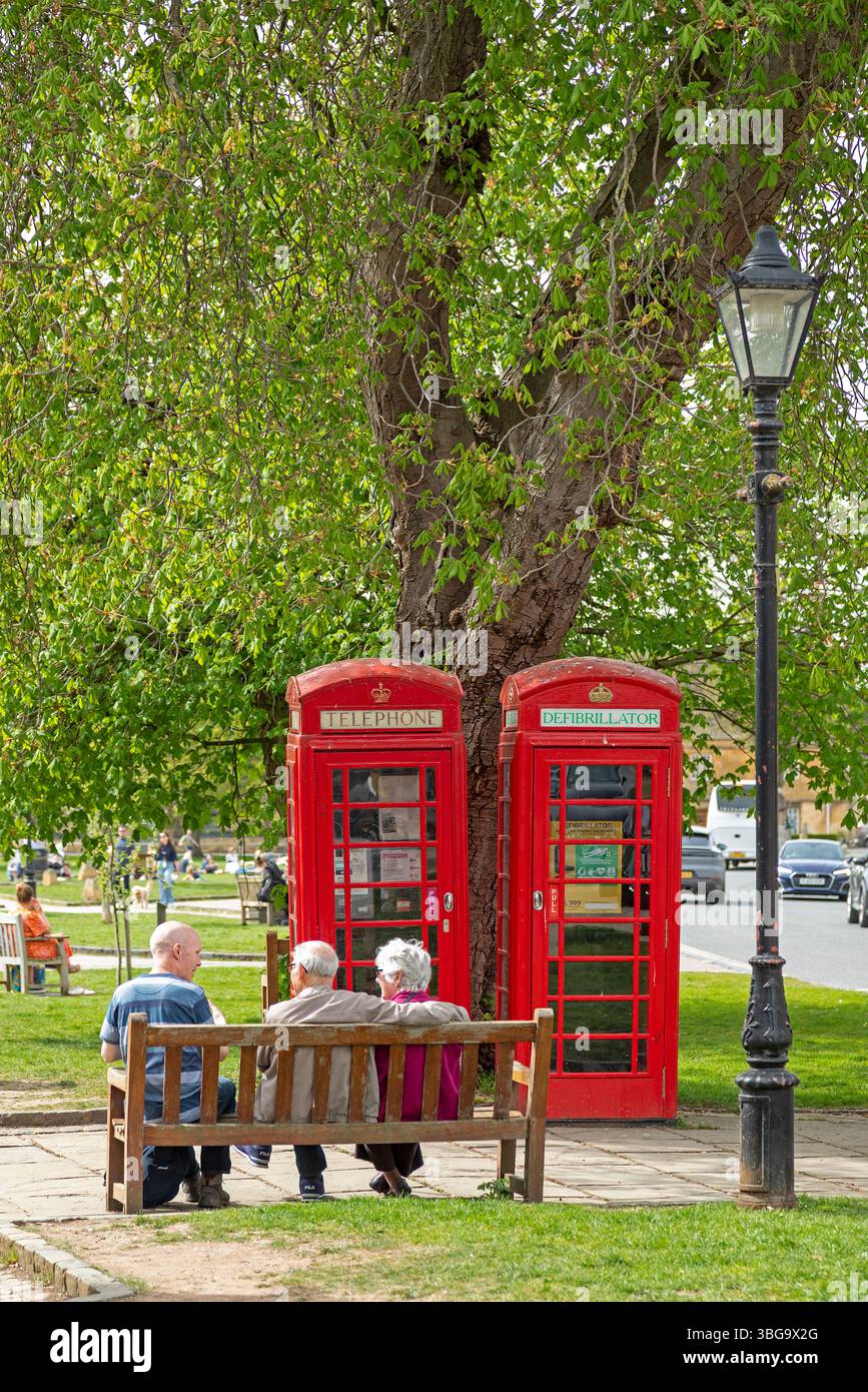 Red telephone booth, defibrillator, people, bench, Broadway ...