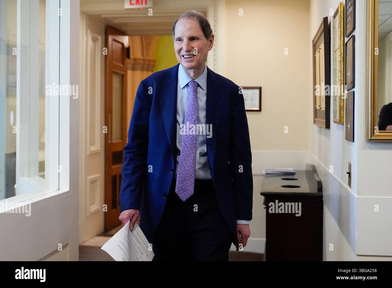 Sen. Ron Wyden, D-Ore., arrives for a news conference on President ...