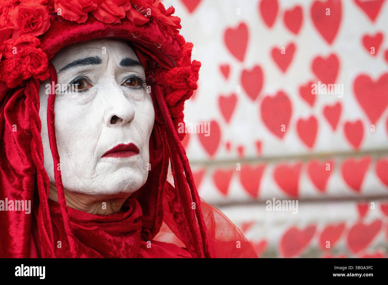 London, UK. 4 June, 2025. The Red Rebel Brigade activist mime troupe ...
