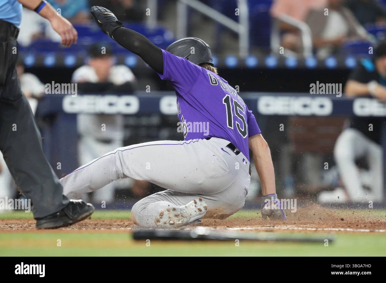 Colorado Rockies' Hunter Goodman (15) scores on a sacrifice fly hit by ...