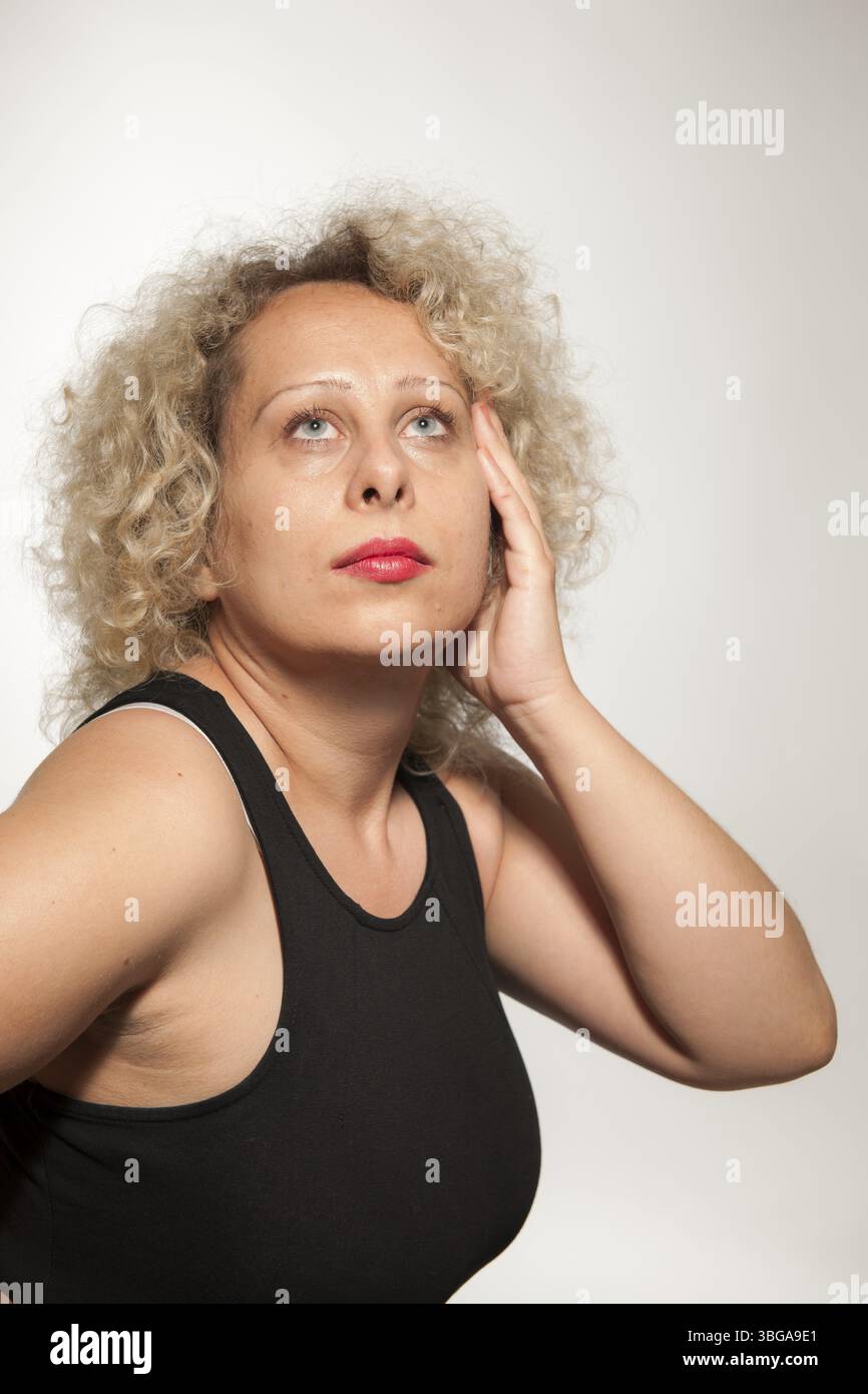 Woman looking sideways upwards hi-res stock photography and images - Alamy
