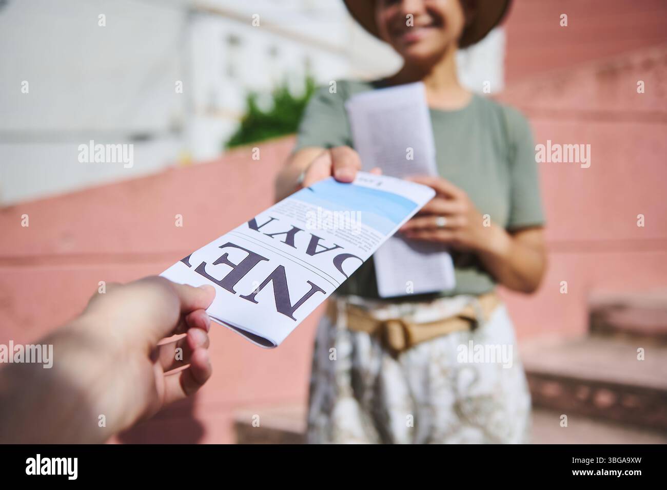 Person giving out flyers hi-res stock photography and images - Alamy